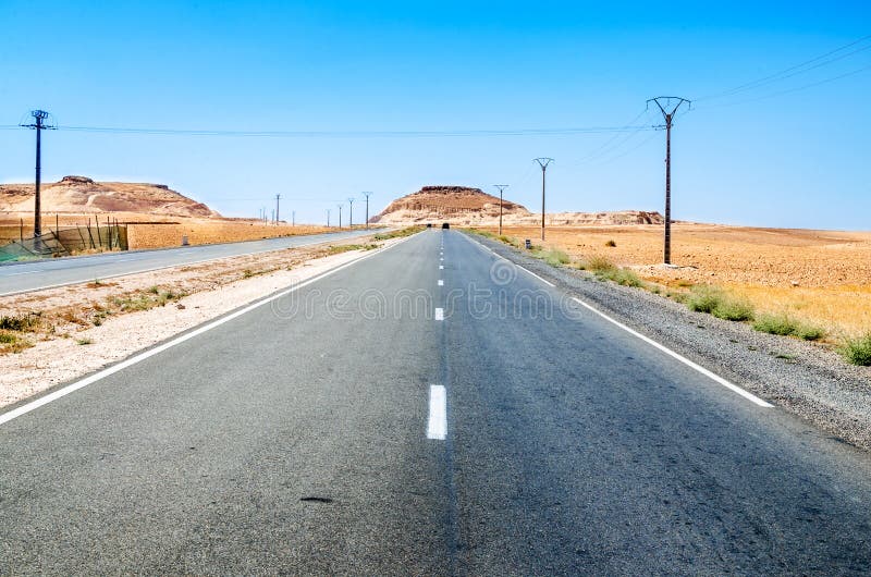 Straight Road in Desert Leading To Small Mountains Stock Photo - Image ...