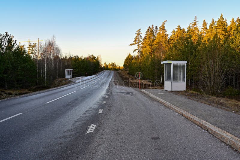 Straight Road through Forest with Two Bus Stops Stock Photo - Image of ...