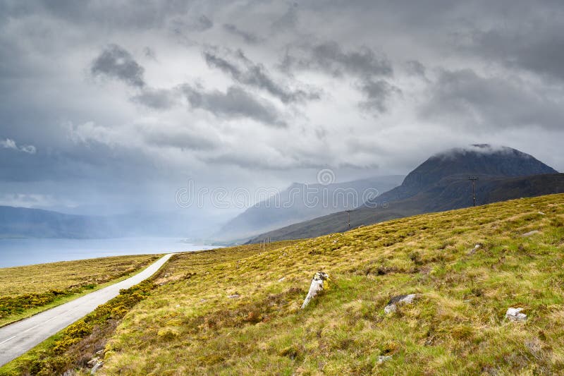 Famous Scenic Road in Scotland with Dramatic Sky and Light at the End ...