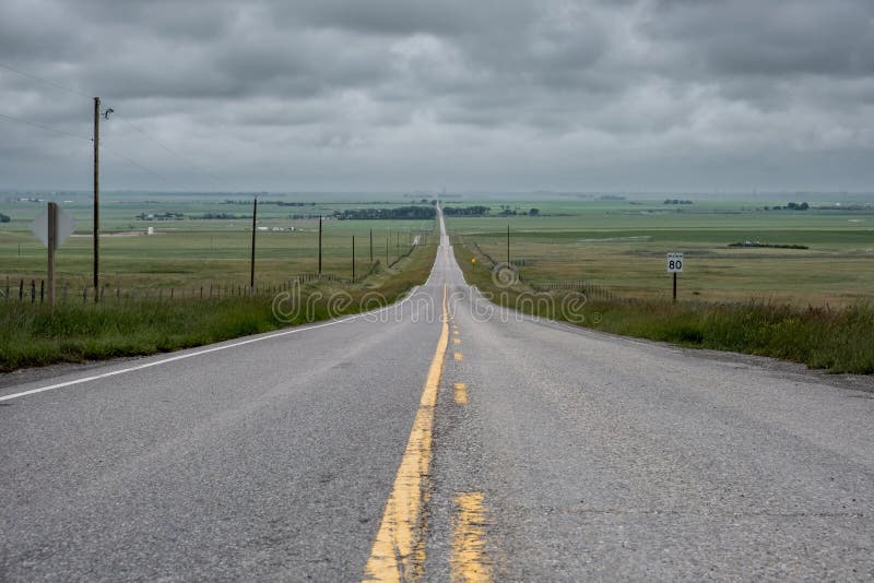 Straight Road in the Vast Plains of Alberta Stock Photo - Image of ...
