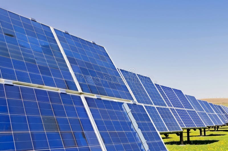 A Straight Row of Solar Panels in a Vast Field Under the Sun, Check the ...