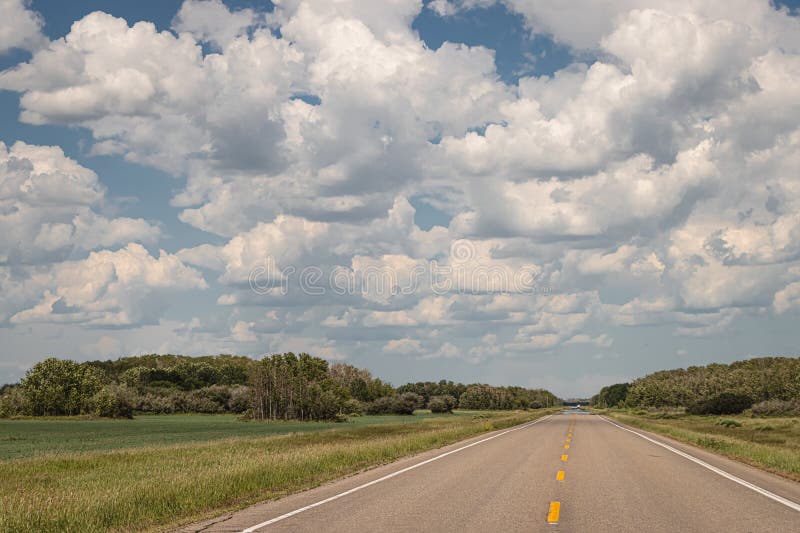 Straight Saskatchewan Highway Under Thick, Summer Cloud Coverage Stock ...