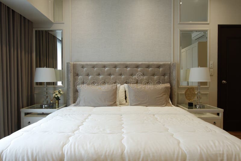Straight Shot of a Large Bed in a Modern Home Stock Image - Image of ...