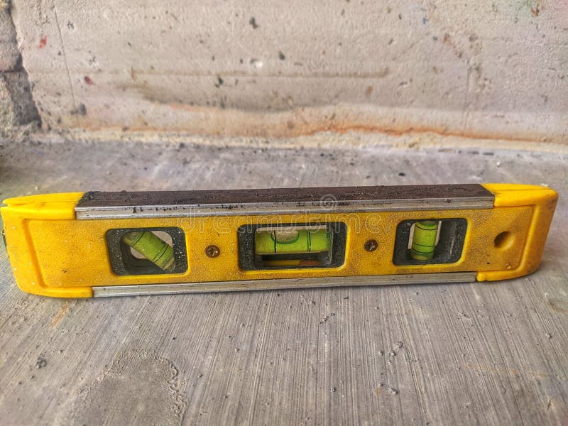 This is a Straightedge Builders Level Stock Photo - Image of yellow ...