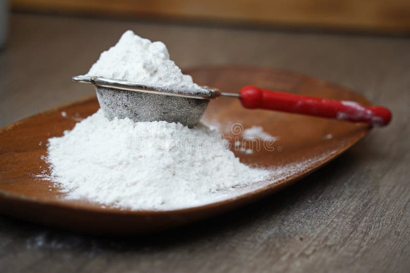 A Strainer with a Handful of Flour Lies on the Table Stock Image ...