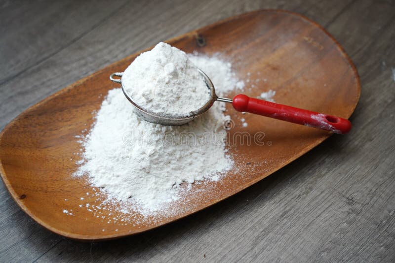 A Strainer with a Handful of Flour Lies on the Table Stock Image ...