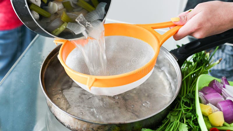 Straining a Delicious Fish Soup Called Chilcano Peruvian Food. Stock ...