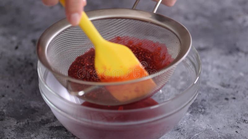 Straining Raspberry Puree through a Mesh Sieve: Straining Seeds Out of ...