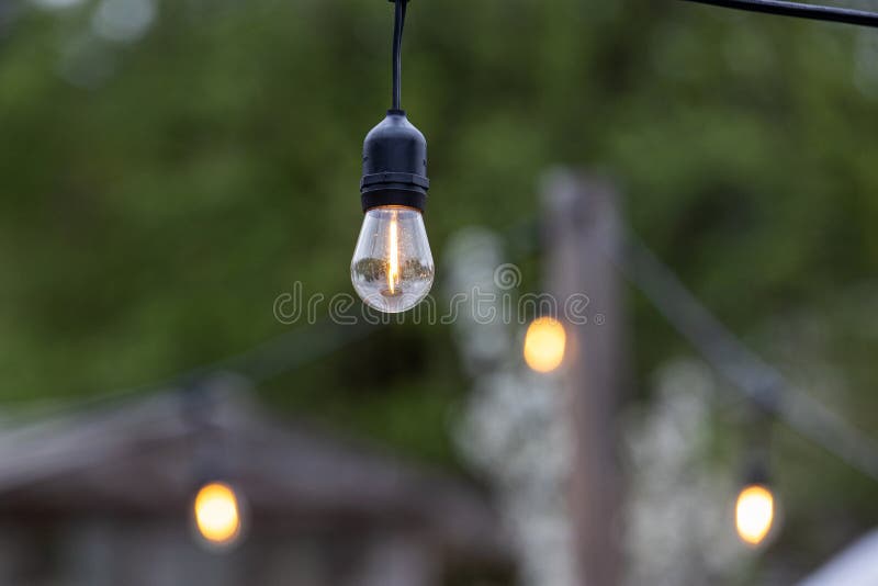 Strand of Outdoor Lightbulbs Stock Image - Image of hangs, lighting ...