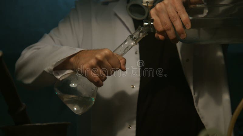 Strange Scientist Pours Liquid in a Flask Stock Video - Video of ...