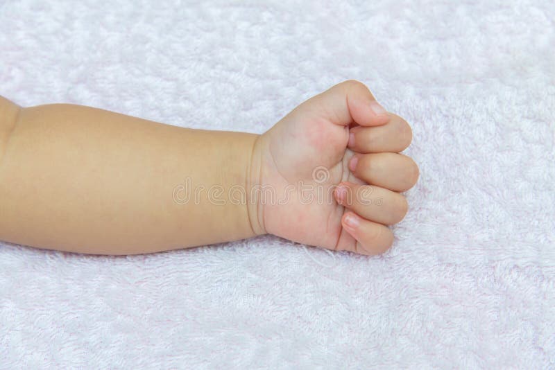 Stranglehold Hand of the Baby on White Diapers Stock Photo - Image of ...