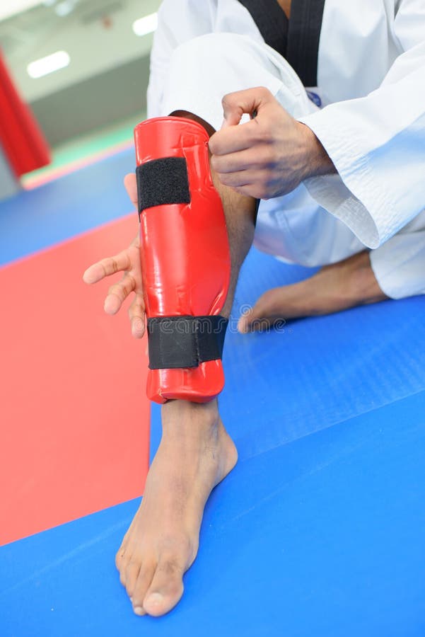 Strapping the shin guard stock image. Image of development - 133513161