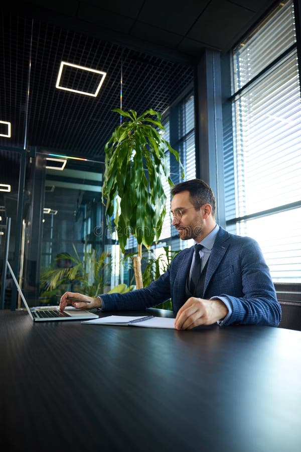 Strategic Thinking. Businessman Analyzing Data on Laptop, Making Key ...