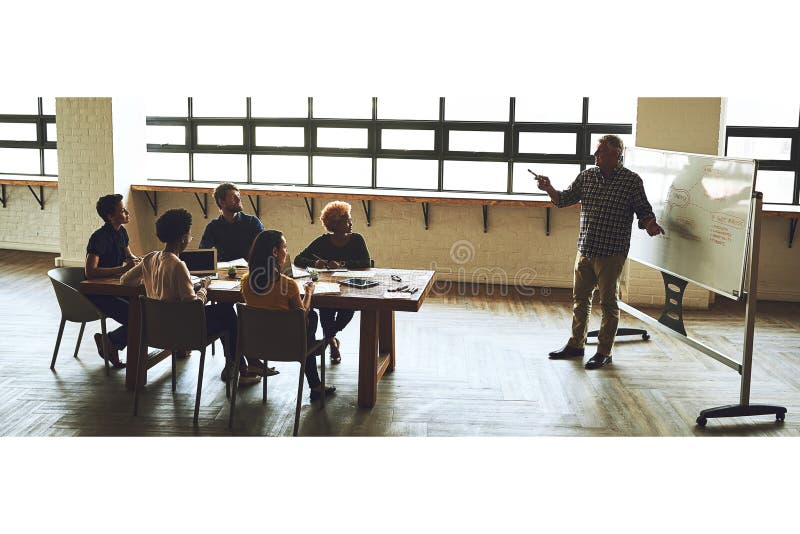 Strategizing with His Team. a Group of Colleagues Having an Office ...