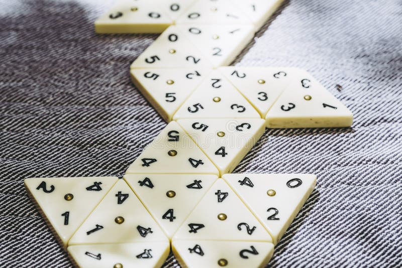 Strategy Game with Triangle Shaped Pieces and Numbers To Line Up Stock ...