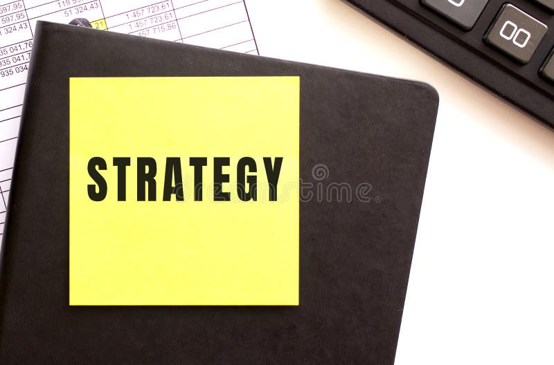 STRATEGY Text on a Sticker on Your Desktop. Diary and Calculator Stock ...
