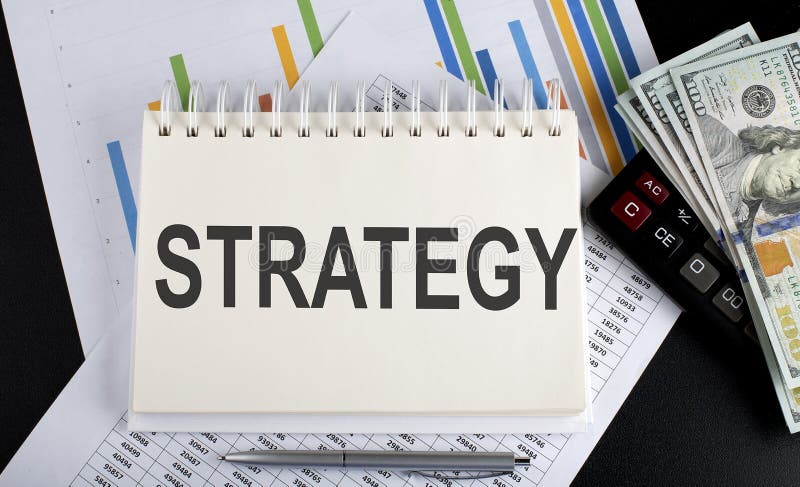 STRATEGY Text Written on the Notebook with Chart,calculator and Dollars ...