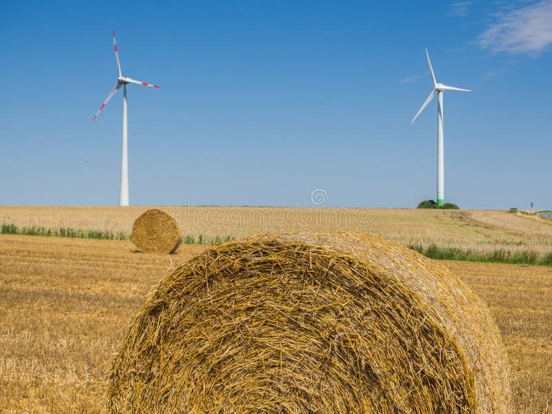 Straw Bale with Wind Turbines Stock Photo - Image of landscape, wind ...