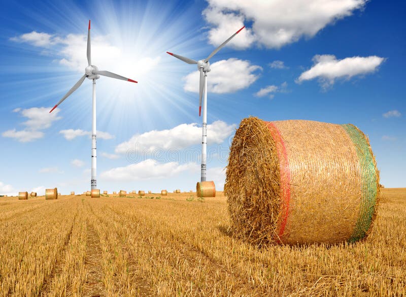 Straw Bales on Farmland with Wind Turbine Stock Photo - Image of ...