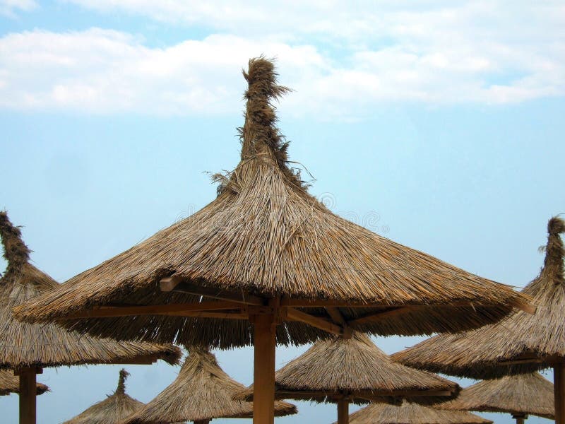 Straw beach shades stock photo. Image of water, clear - 42705330