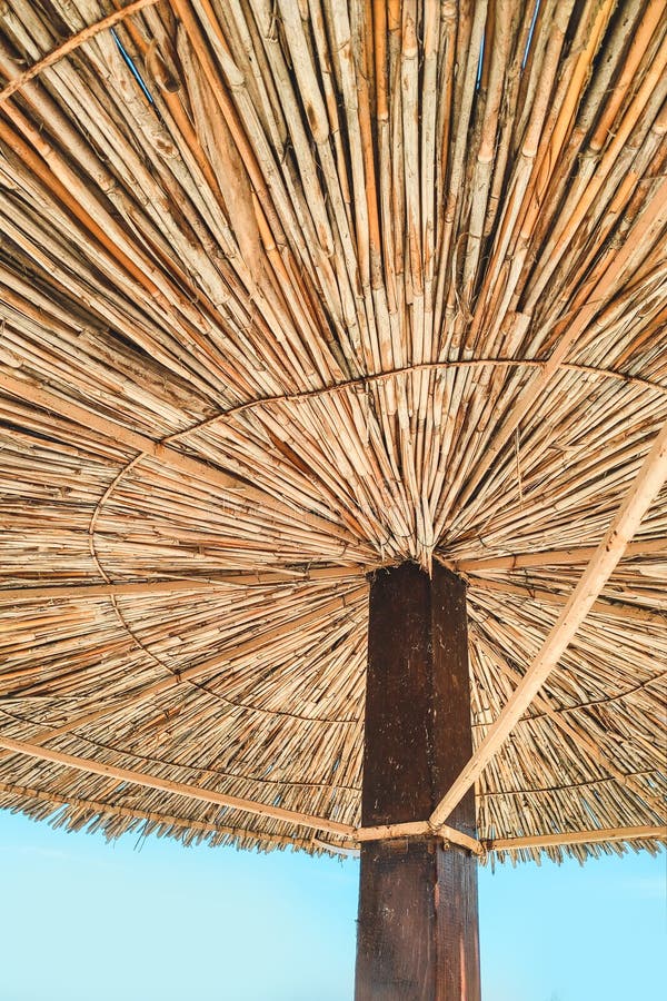 Straw Beach Umbrellas on a Background of Blue Sky, Vacation Concept ...