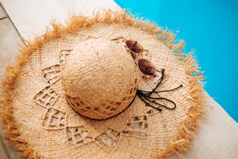 Straw Hat and Goggles by the Pool. Stock Photo - Image of concept ...