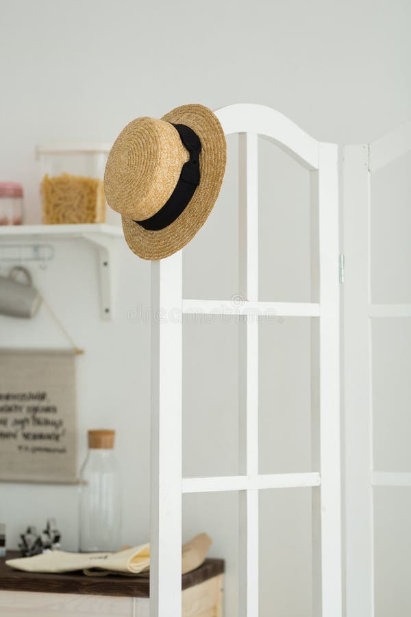 Straw Hat Hanging on a White Screen in the Room Stock Image - Image of ...