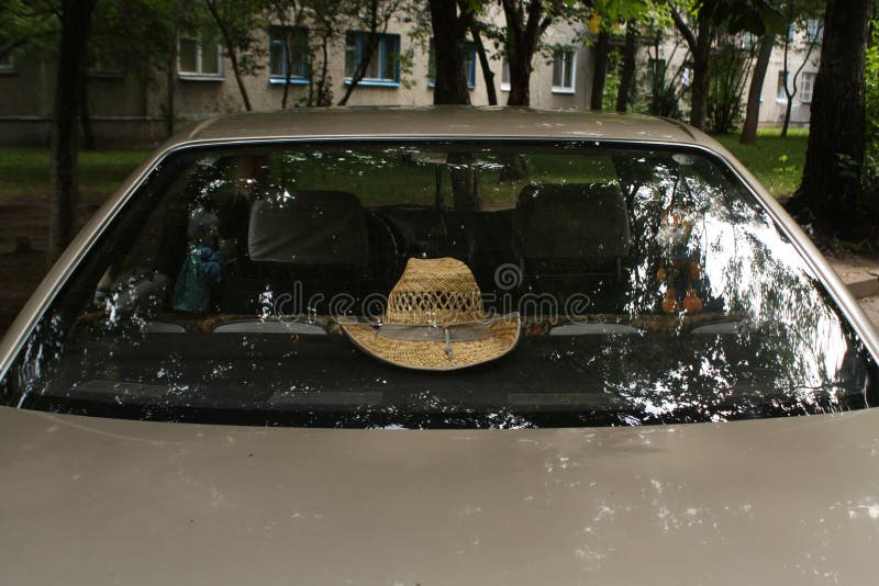Straw hat inside car. stock image. Image of outdoors - 72391429