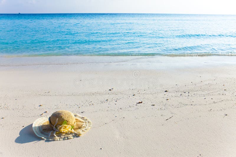 Straw Hat Lay on Sand at Edge of Sea Stock Image - Image of sunny ...