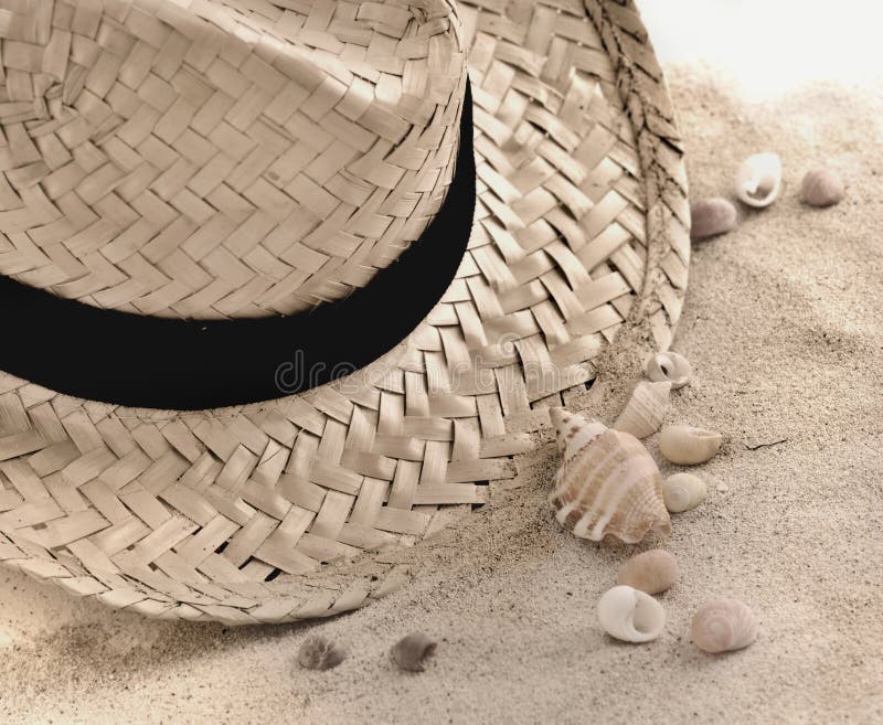 Straw hat in the sand stock photo. Image of sand, summer - 72348904