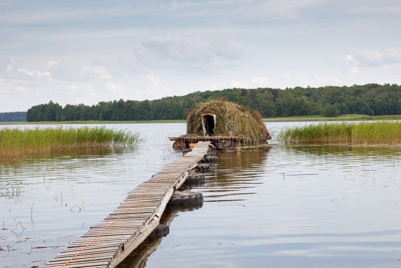 Straw house in water stock photo. Image of tourism, shack - 54858464