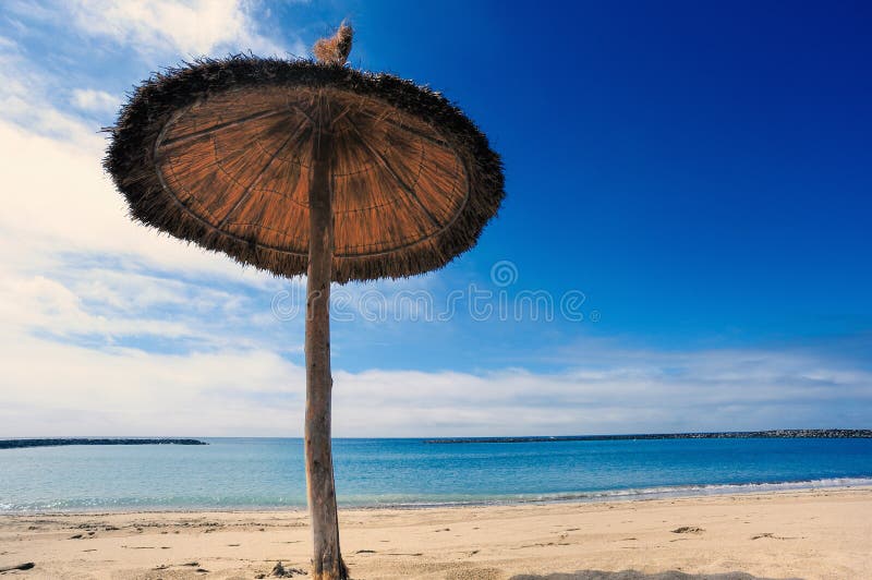 Straw Parasol stock photo. Image of coast, sand, leisure - 46167456