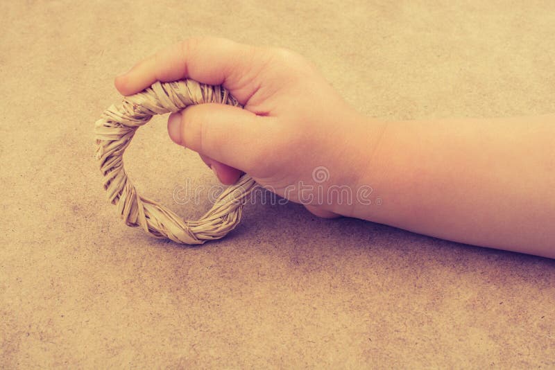 Straw ring in hand in view stock photo. Image of grunge - 131920474