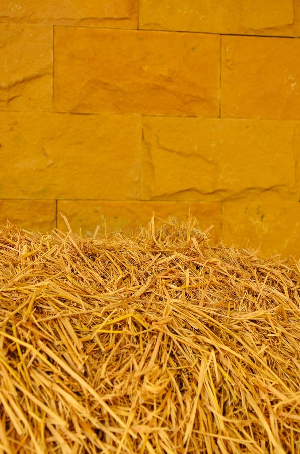 Straw Stack and Yellow Brick Wall Stock Image - Image of stack, wall ...