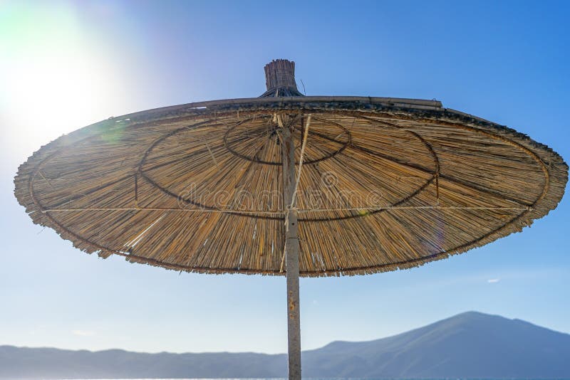 Straw Sun Hat Canopy on the Beach Seen from Below with Sun from the ...