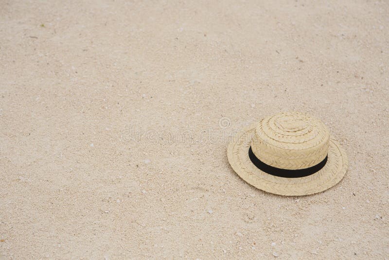 Straw sun hat in the sand stock photo. Image of nature - 27338252