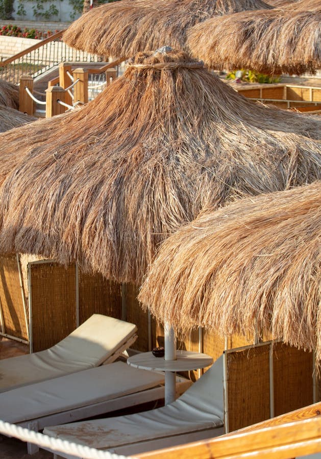 Straw Sun Lounger on the Beach. Stock Photo - Image of relaxation ...