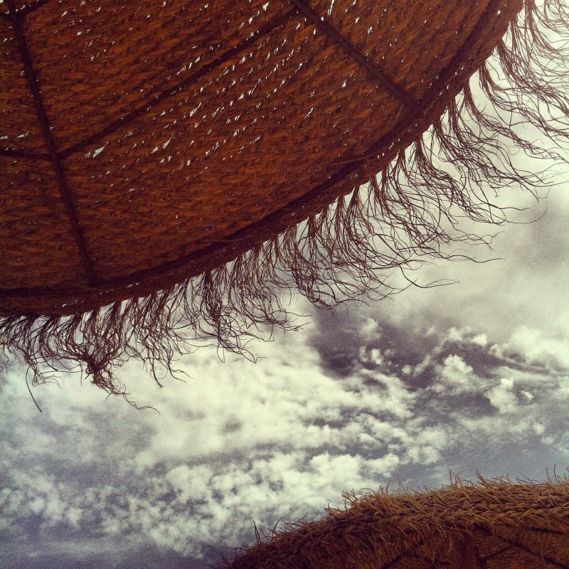 Straw Sun Umbrella stock photo. Image of bright, straw - 28634190