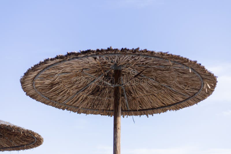 Straw Umbrellas on the Beach Stock Image - Image of turquoise, shore ...
