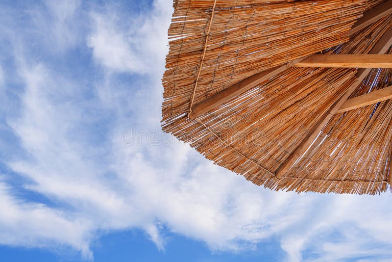 Straw Umbrellas with Sunbeds on the Beach Stock Image - Image of ...
