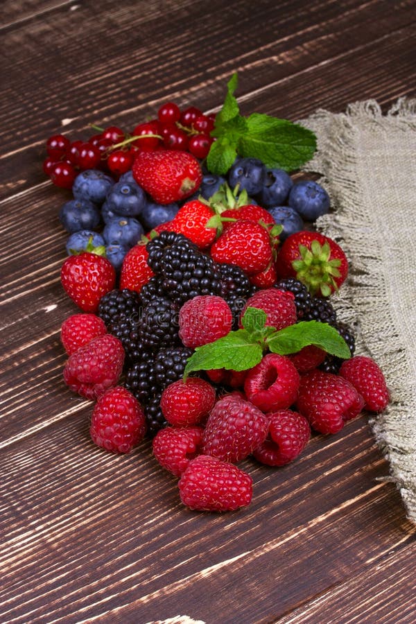 Blueberries and Raspberries in Clay Bowl. Freshly Picked Berries on ...