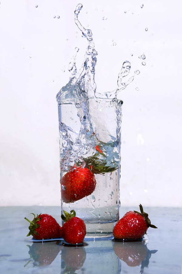 Strawberries Fall into a Glass of Water. Stock Image - Image of glass ...