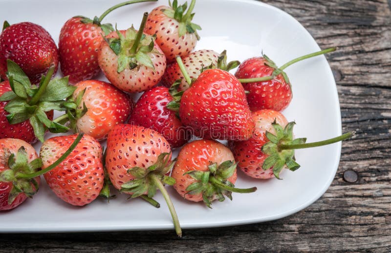 Strawberries on an Old Wooden Textured Table Top Stock Image - Image of ...