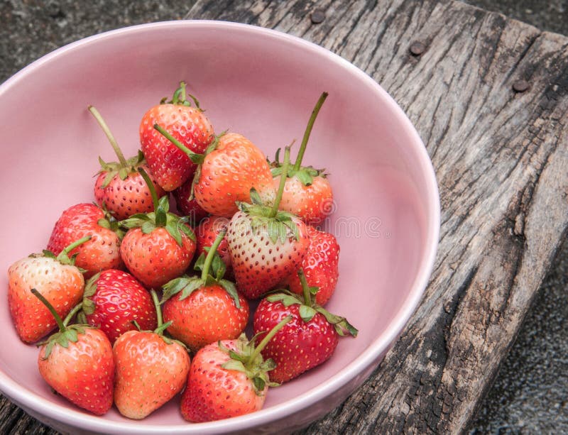 Strawberries on an Old Wooden Textured Table Top Stock Photo - Image of ...