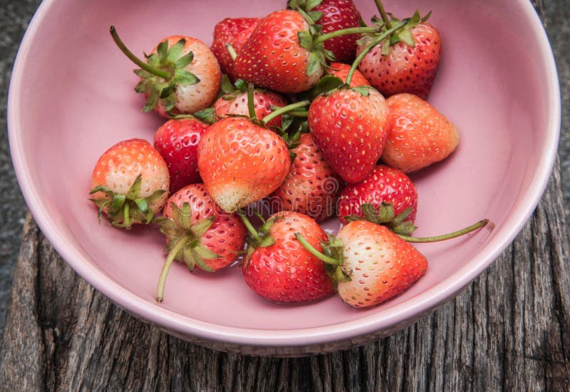 Strawberries on an Old Wooden Textured Table Top Stock Photo - Image of ...