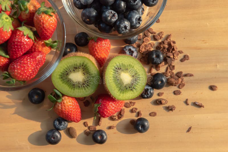 Strawberries and Raspberry on the Table Stock Photo - Image of bowl ...