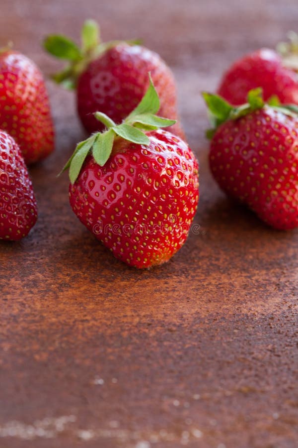 Strawberries Ripe on a Rustic Rust Background. Stock Image - Image of ...