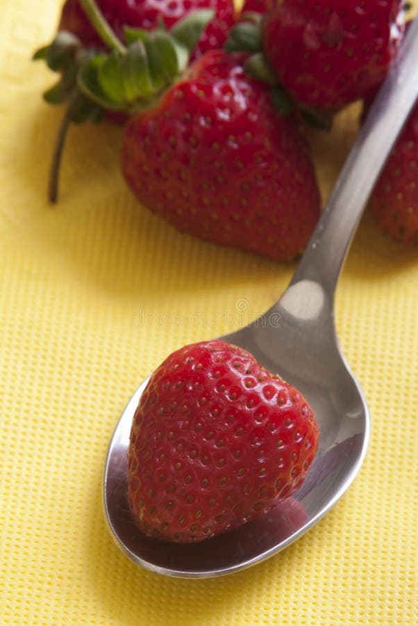 Strawberries with a spoon stock photo. Image of yellow - 17035012
