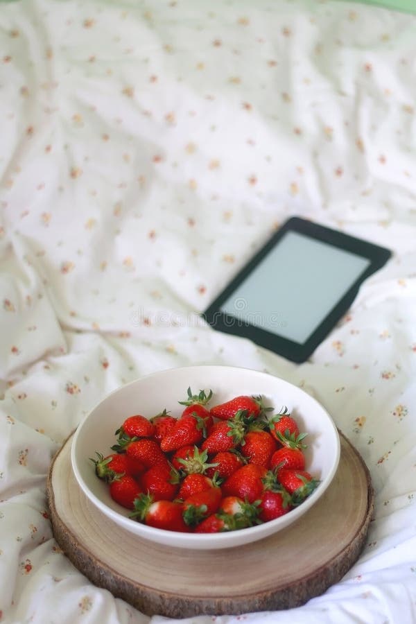 Strawberries and Tablet stock photo. Image of screen - 217129030
