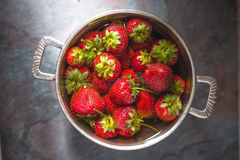 Strawberries in a Tin Bowl in the Center of the Table Stock Photo ...